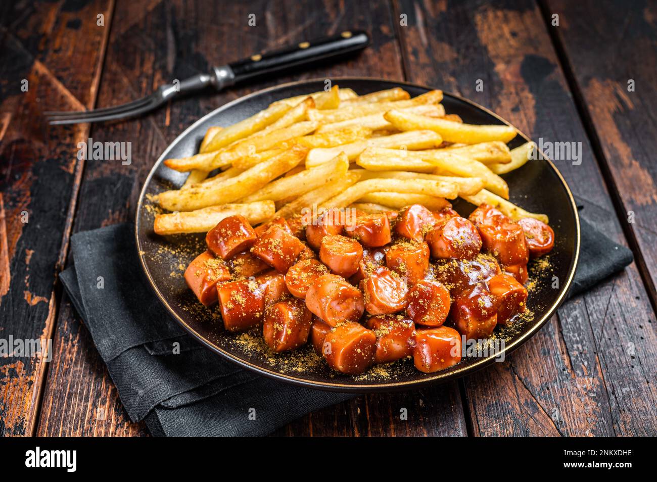 German currywurst meal, curry wurst with french fry served in a plate ...