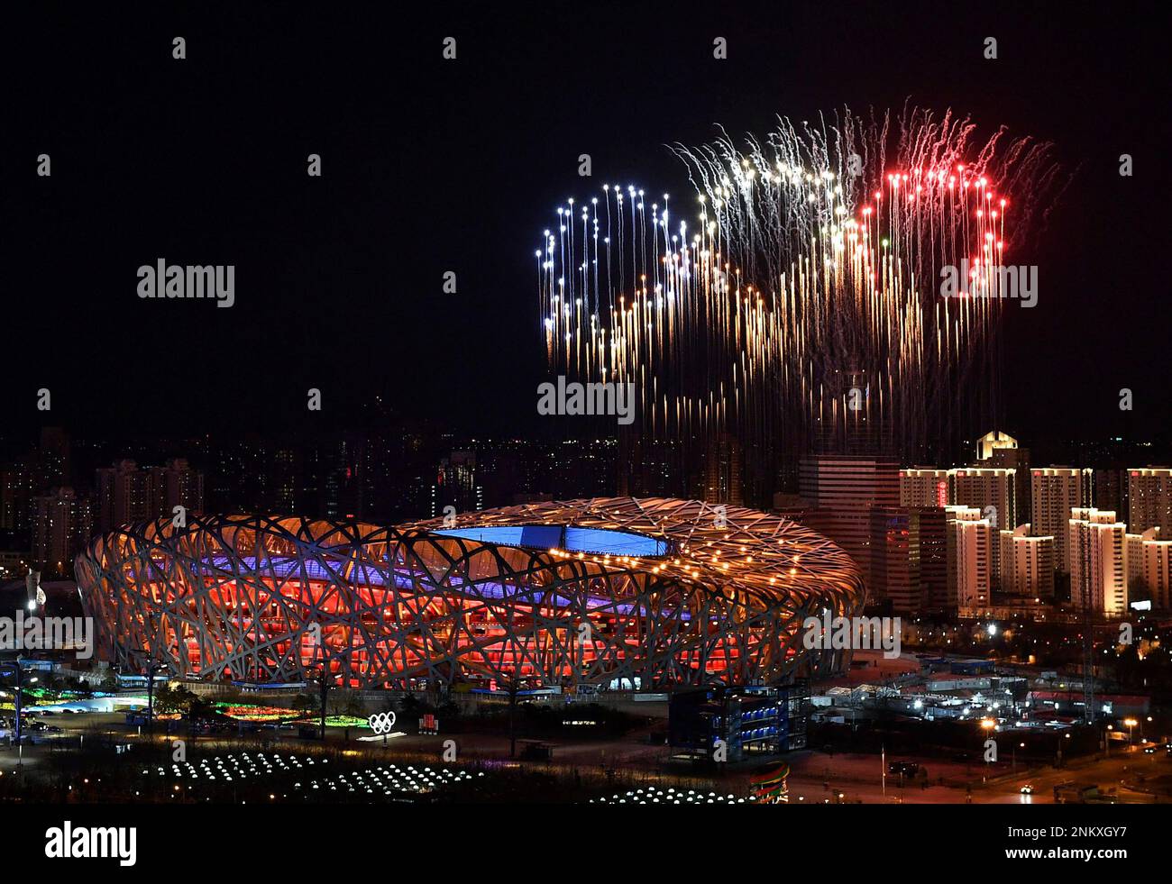 Fireworks, forming the Olympic rings, illuminate the sky during the ...