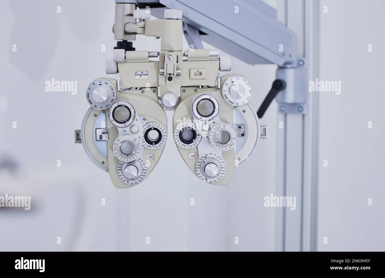 Phoropter, medical optometry and equipment in hospital for eye test or ...