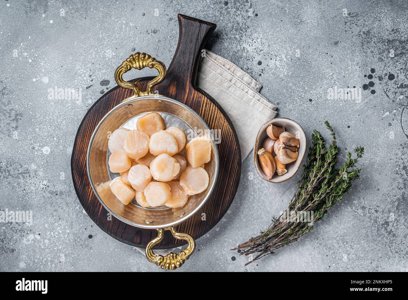 Raw sea scallops fillets in a skillet. Gray background. Top view Stock ...