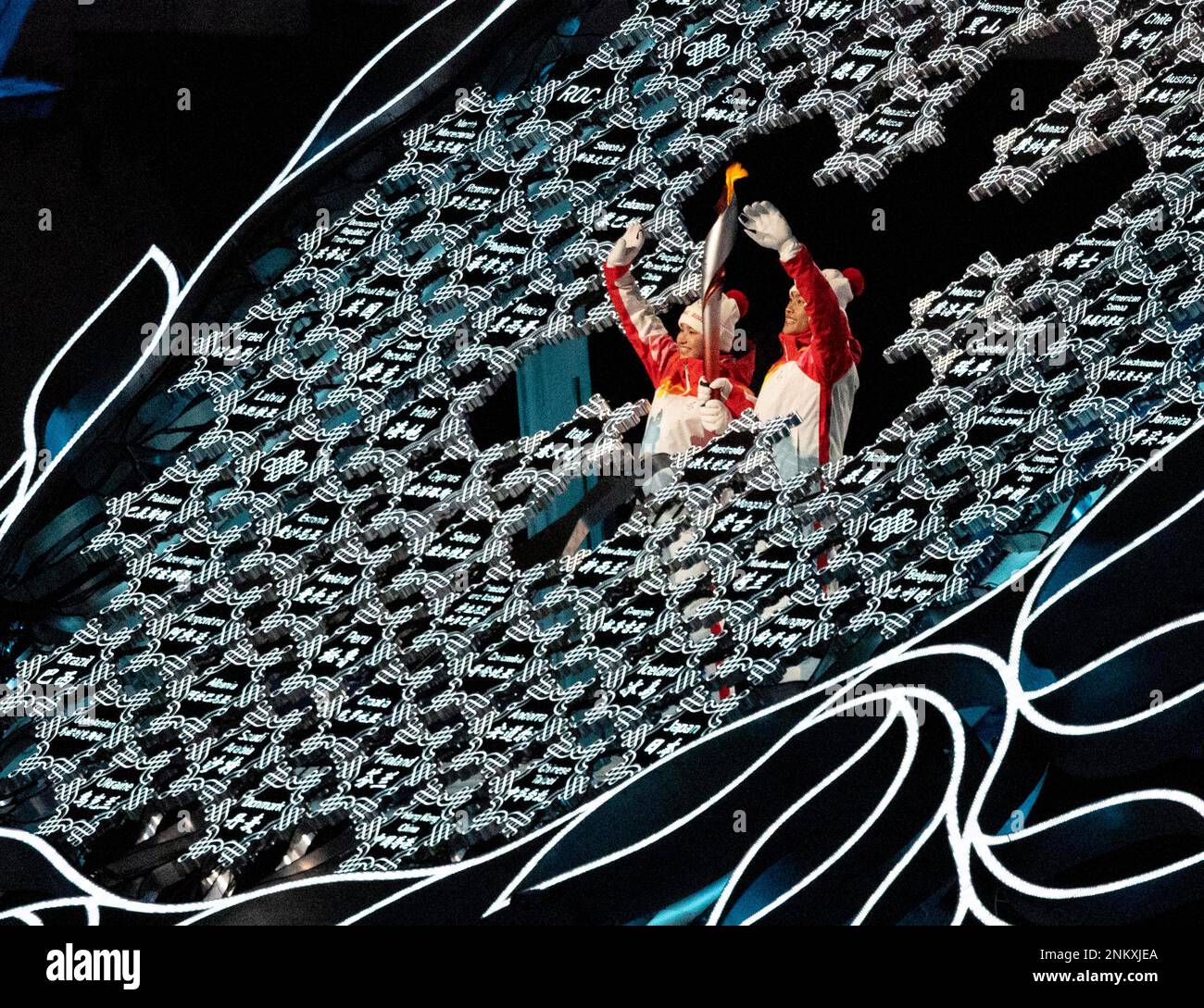 February 4, 2022, Beijing, China: Torch bearers DINIGEER YILAMUJIANG ...