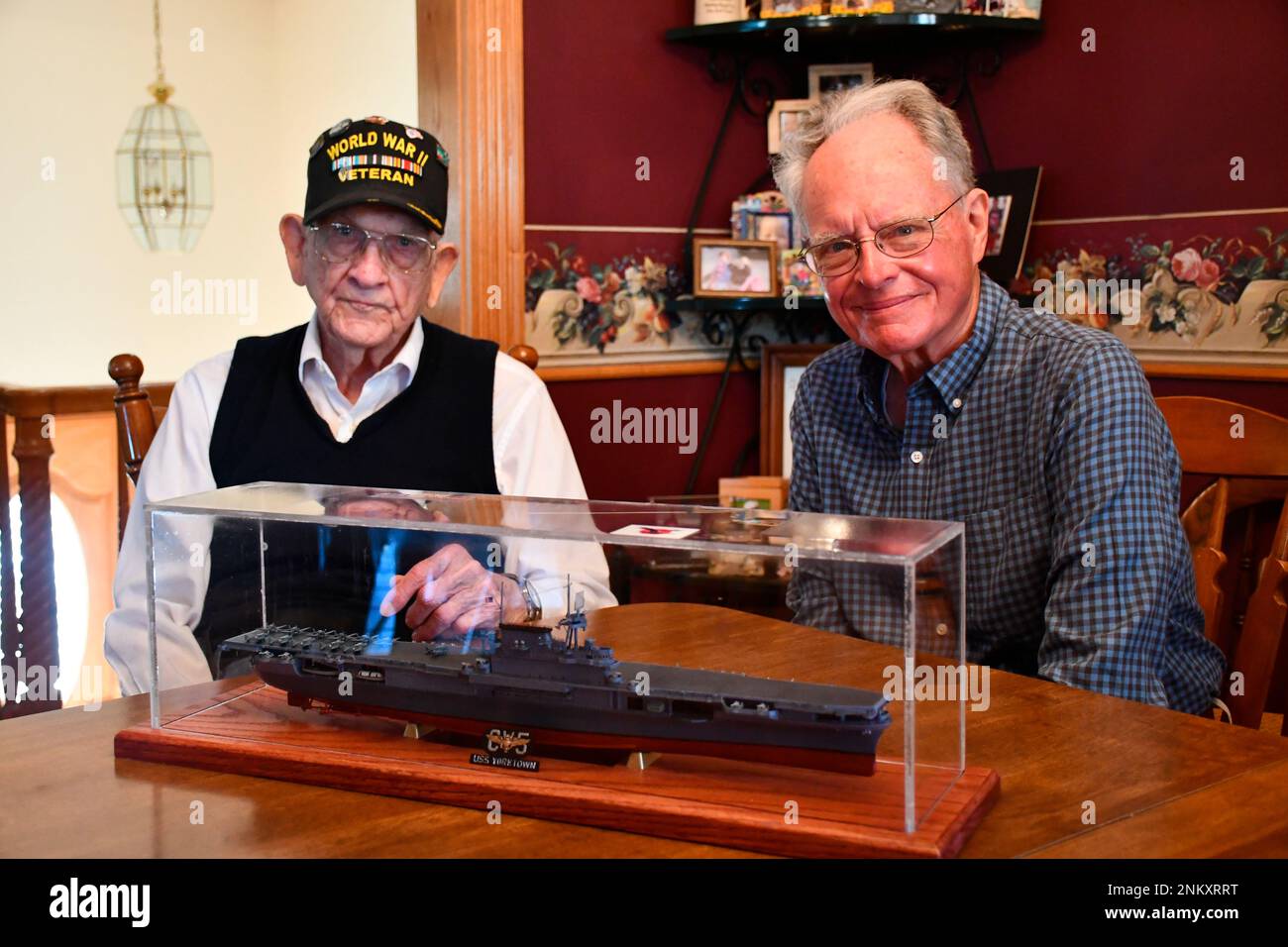 Julian Hodges, left, and David Denny, right, pose with a replica model ...