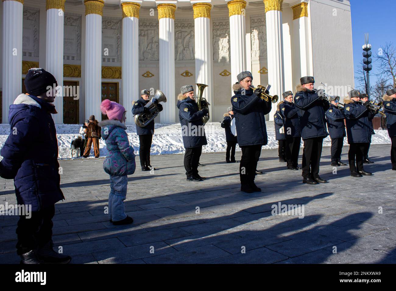 A child listens to a military orchestra in the VDNKh park in Moscow ...