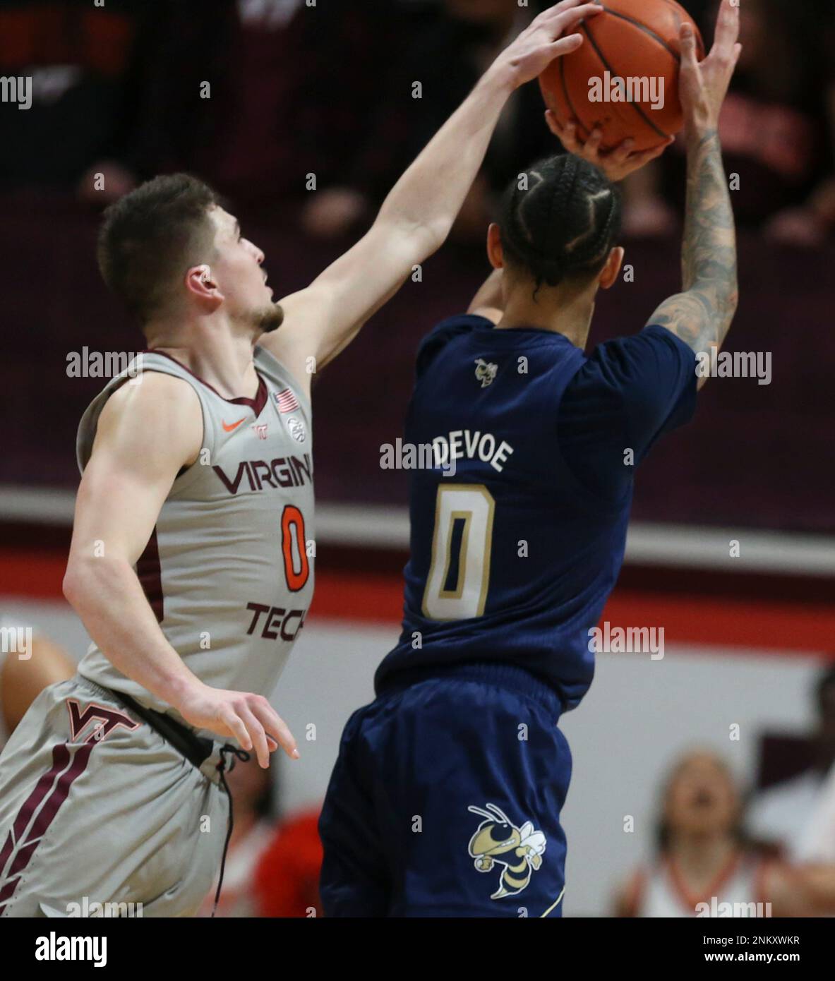 Virginia Tech's Hunter Cattoor (0) left, blocks a shot by Georgia Tech ...