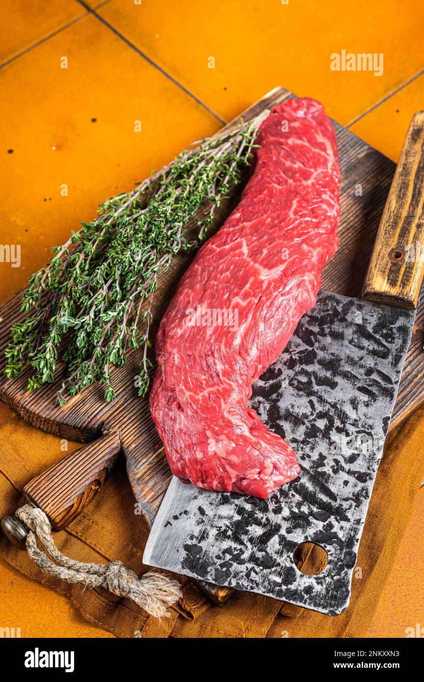 Fresh Raw Machete beef meat steak or hanging tender cut on butcher ...
