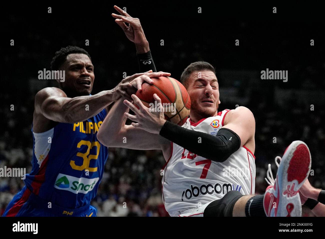 Lebanon's Karim Zeinoun, right, and Philippines' Justin Brownlee battle ...