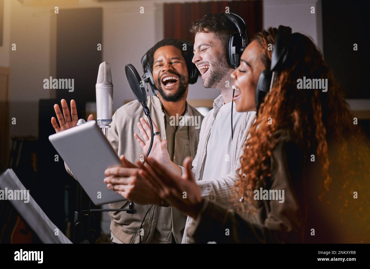 Team, people in recording studio singing and mic, sound equipment with ...