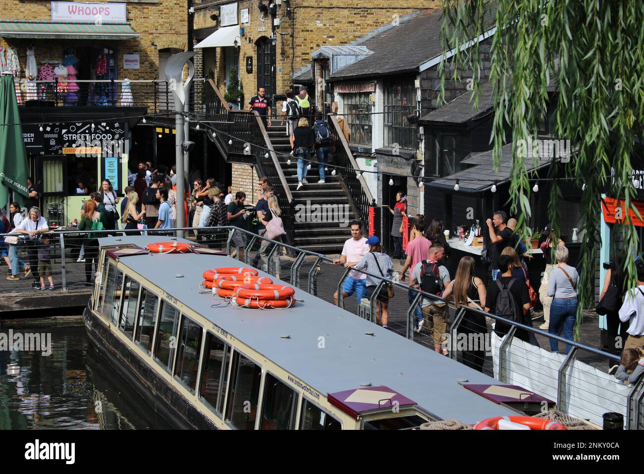A warm summer afternoon at the popular Camden Lock Market with people ...