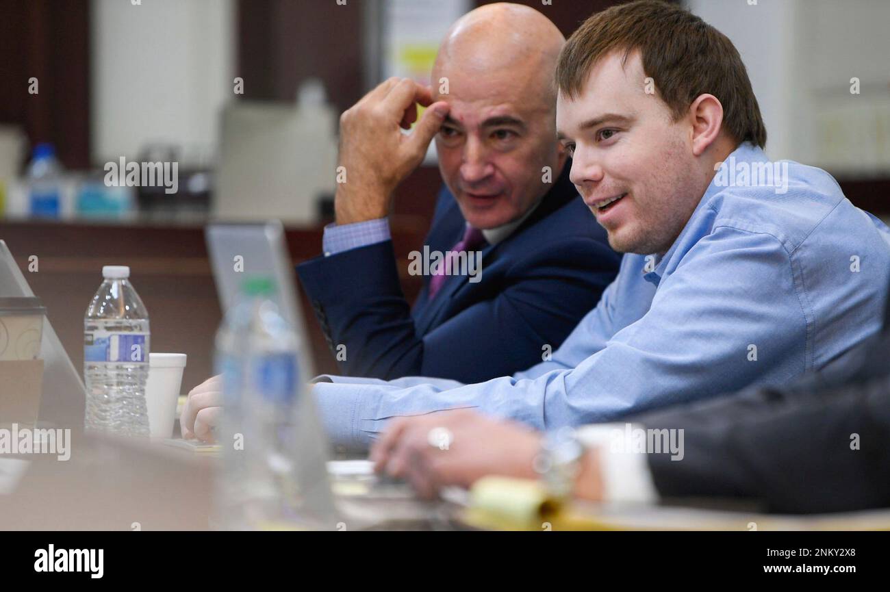 Travis Reinking reacts to his drivers license, when shown in court with ...