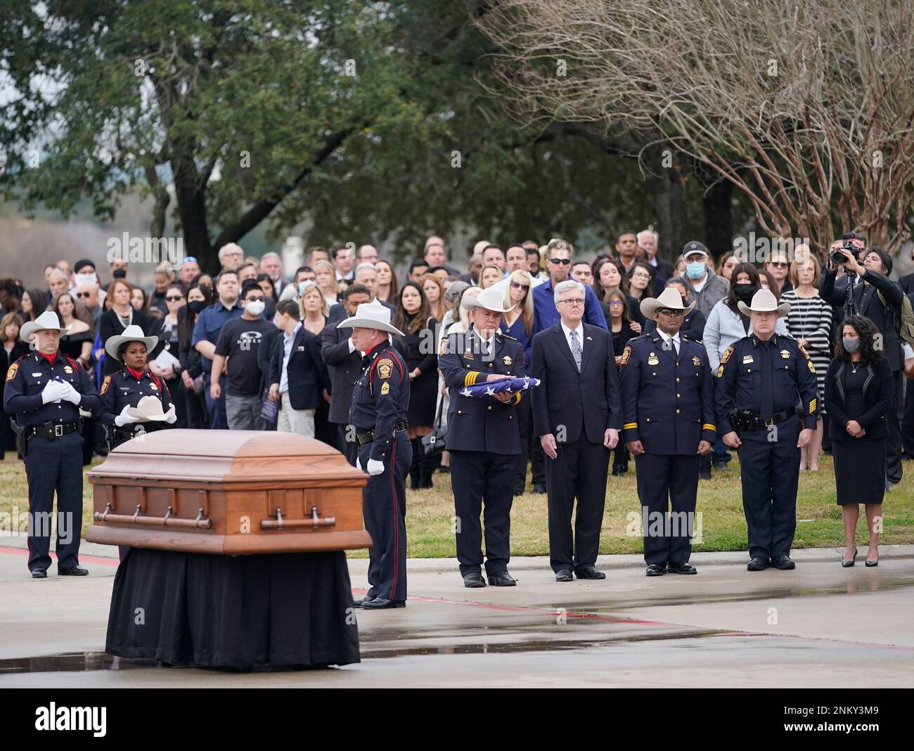 Harris County Precinct 5 Constable Ted Heap holds a folded flag from ...