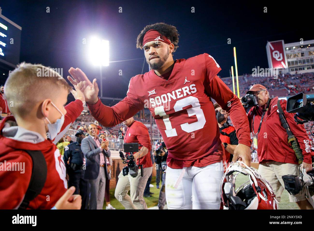 FILE - Oklahoma quarterback Caleb Williams (13) celebrates with fans ...