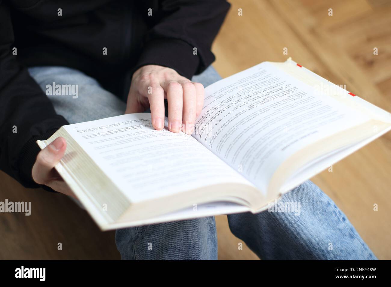 Reading with a book on her lap hi-res stock photography and images - Alamy