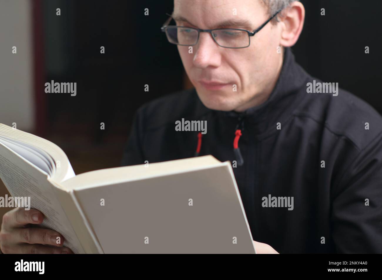 person reads a book on his lap Stock Photo - Alamy person reads a book on his lap Stock Photo - Alamy