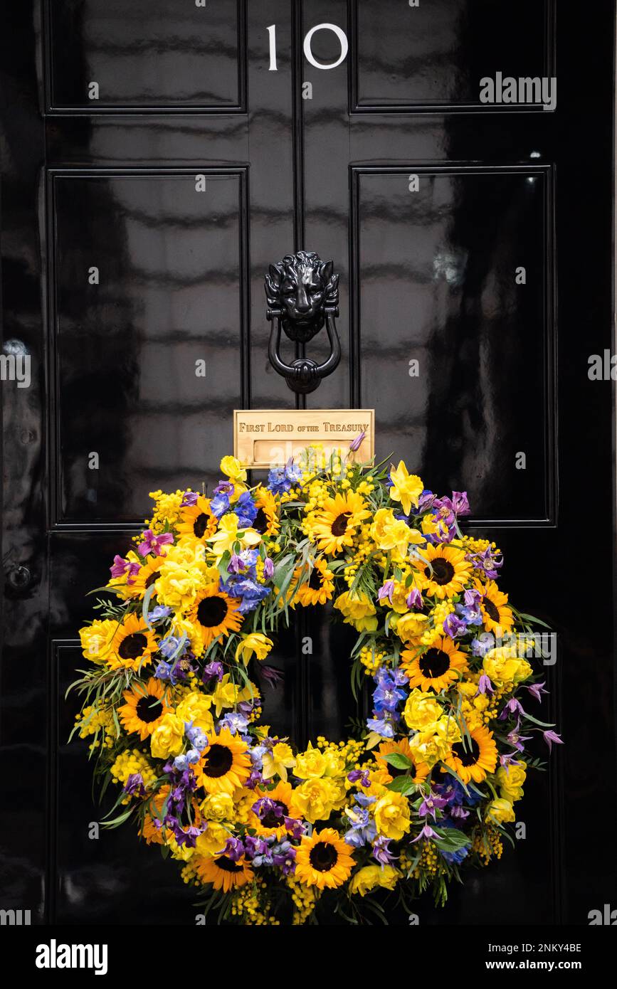 London, UK. 24 February 2023. A wreath decorated with sunflowers the ...