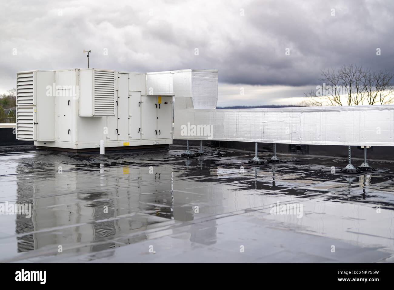 Air conditioning compressor units install on the roof of a commercial ...