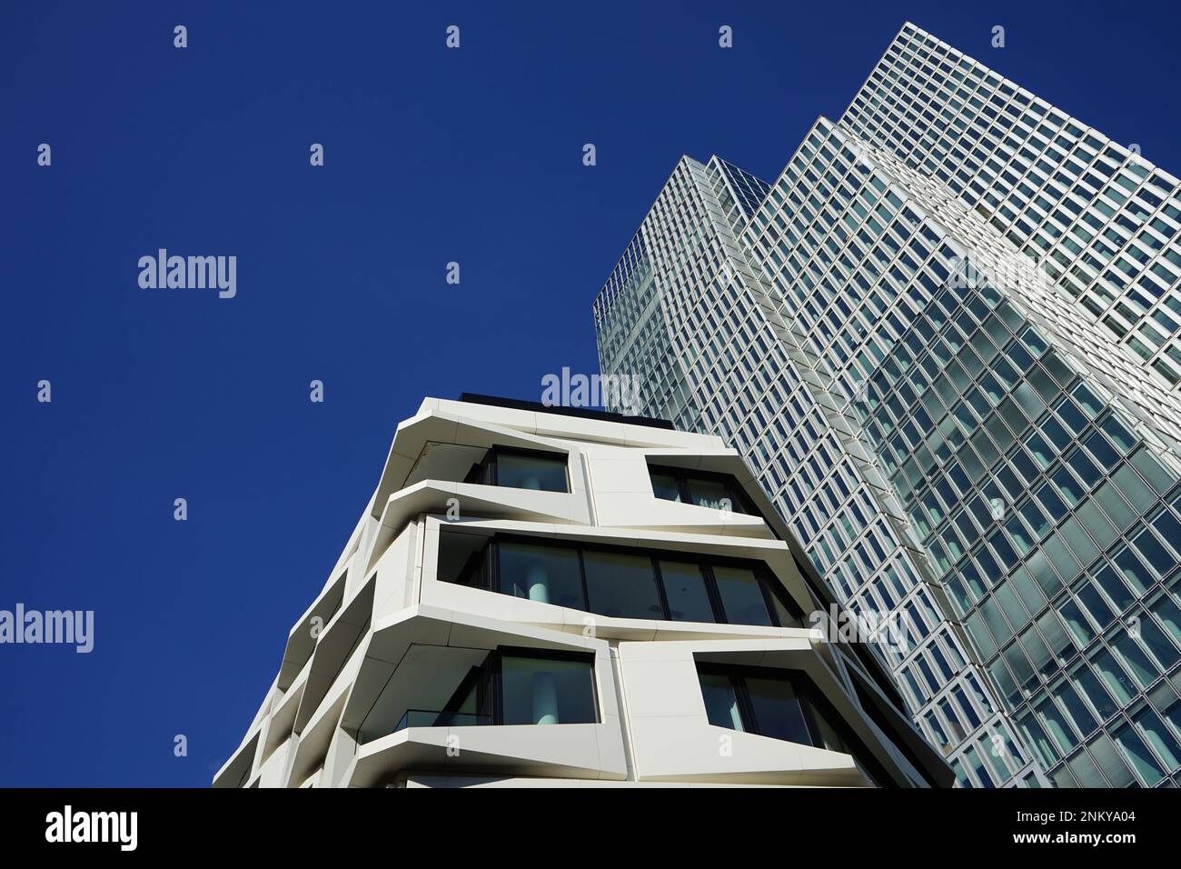 Tall white skyscraper towers under clear blue sky Stock Photo - Alamy