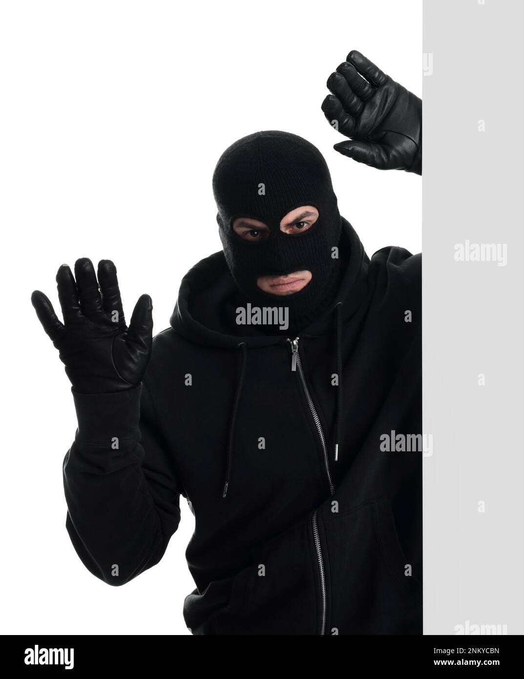 Man wearing black balaclava on white background Stock Photo - Alamy