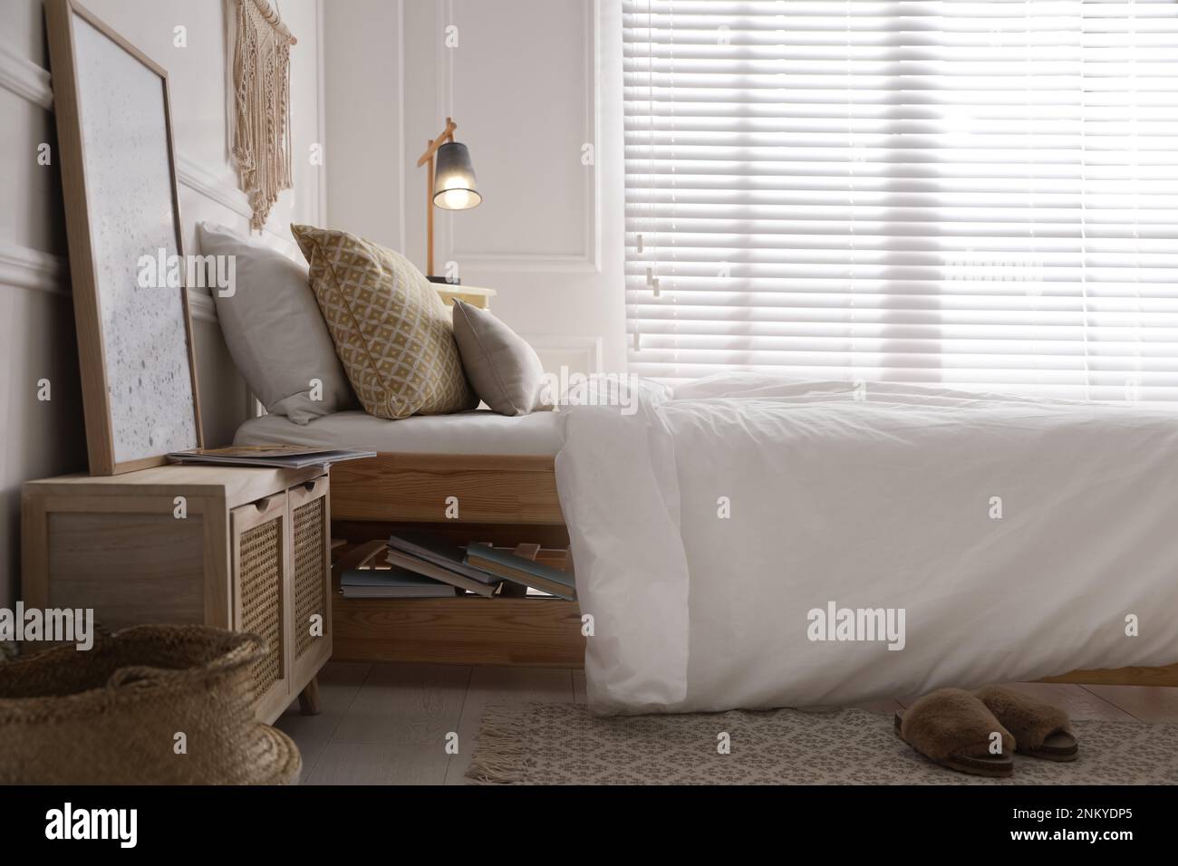 Comfortable bed with clean white linens indoors Stock Photo - Alamy