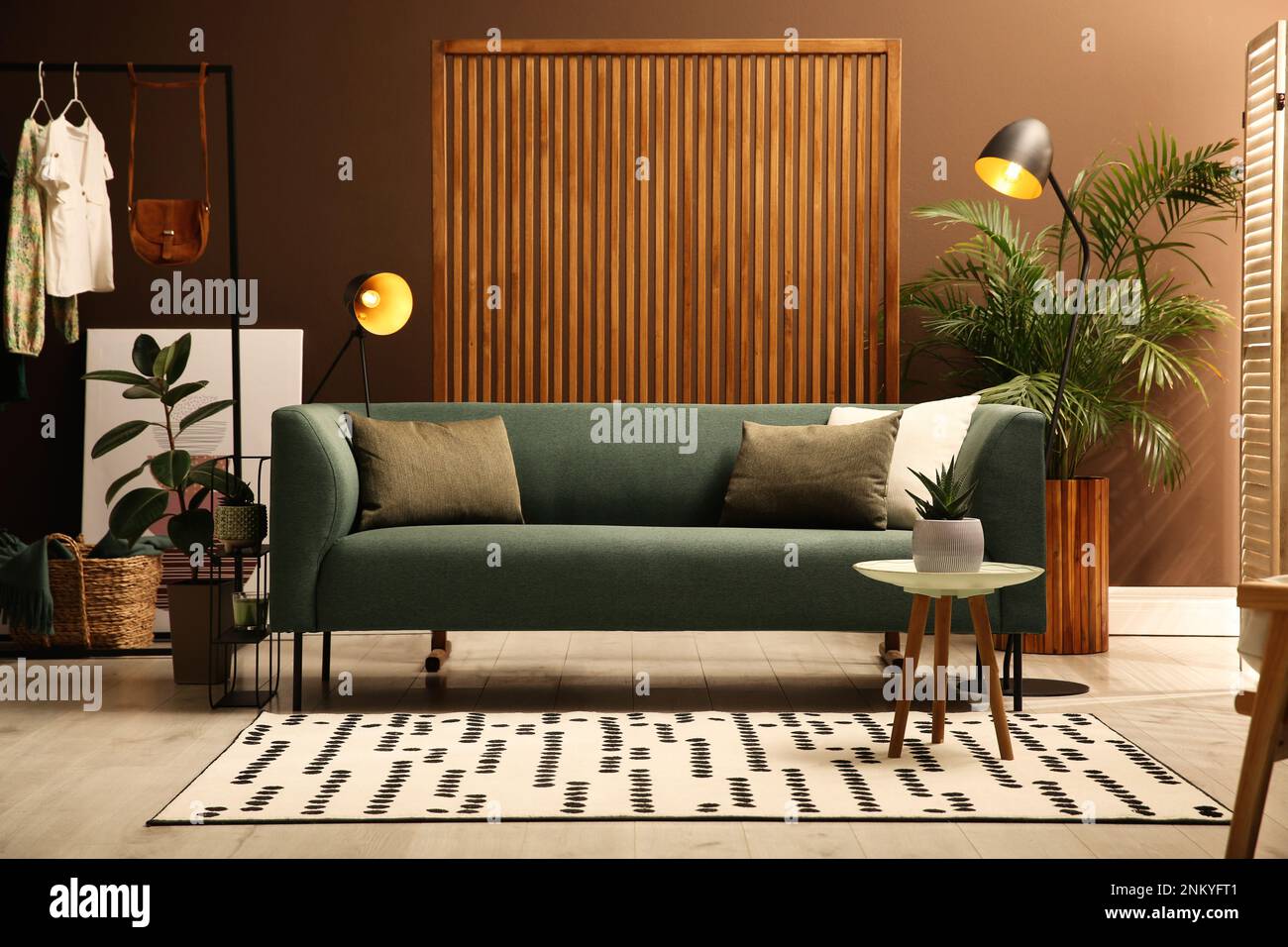 Living room with comfortable green sofa. Interior design Stock Photo ...