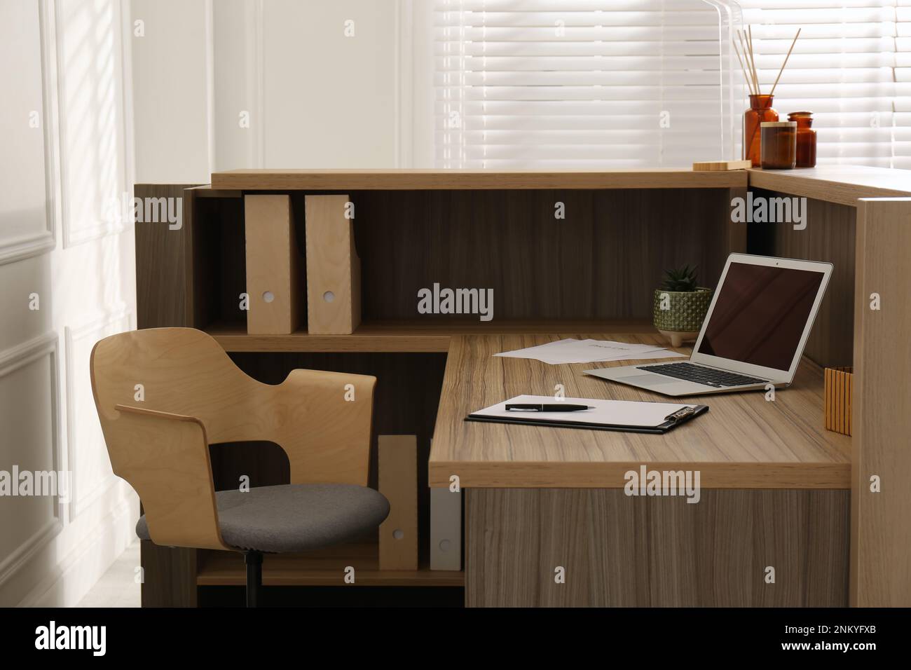 Receptionist's workplace with laptop in hotel. Interior design Stock ...