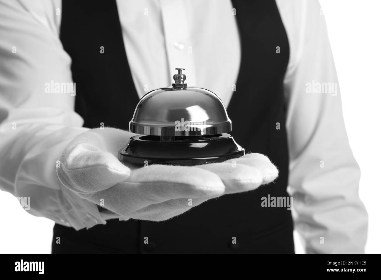Butler holding service bell on white background, closeup Stock Photo ...