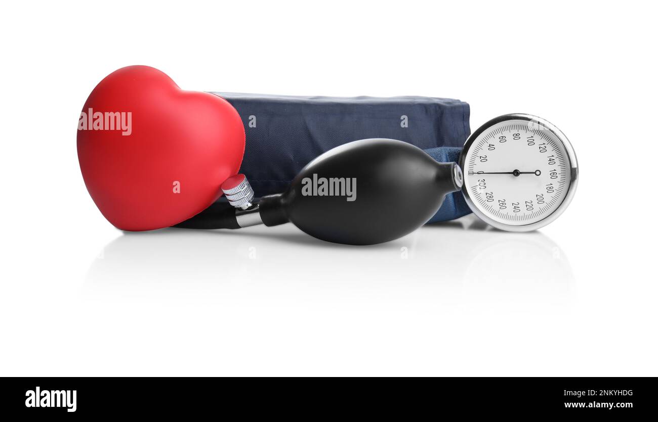 Blood pressure meter and toy heart on white background Stock Photo - Alamy