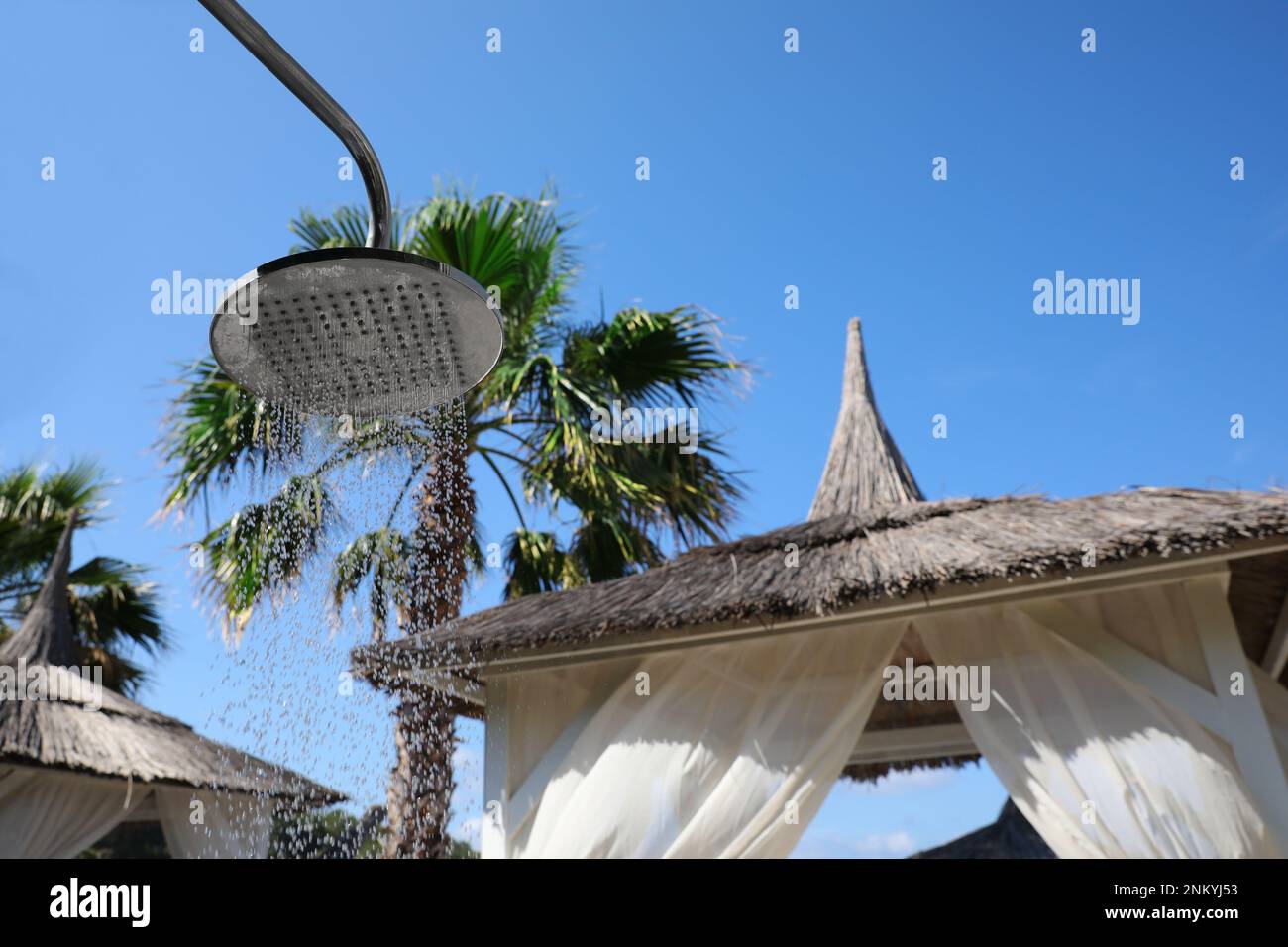 Outdoor shower with running water on beach at resort Stock Photo - Alamy