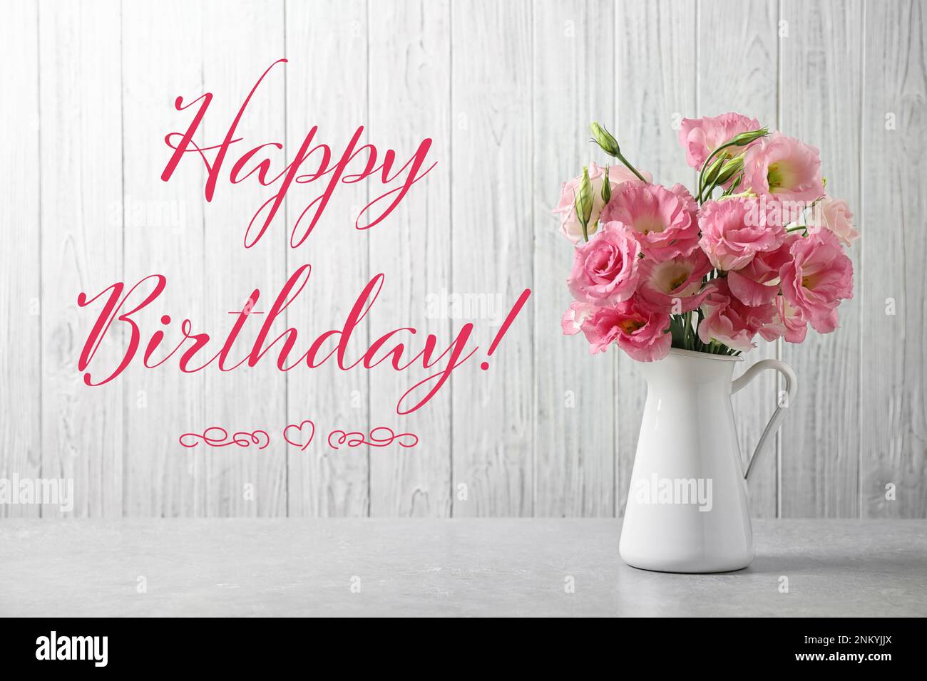 Happy Birthday! Eustoma flowers in vase on white able Stock Photo - Alamy