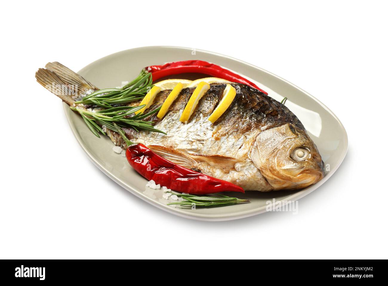 Tasty homemade roasted crucian carp with rosemary on white background ...