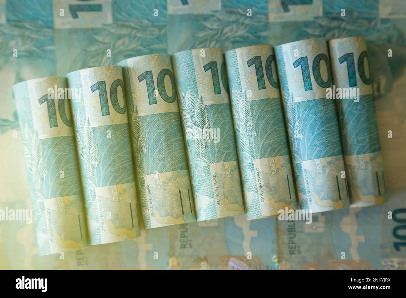 Brazil money stacked - detail on rolled-up one hundred reais bills ...