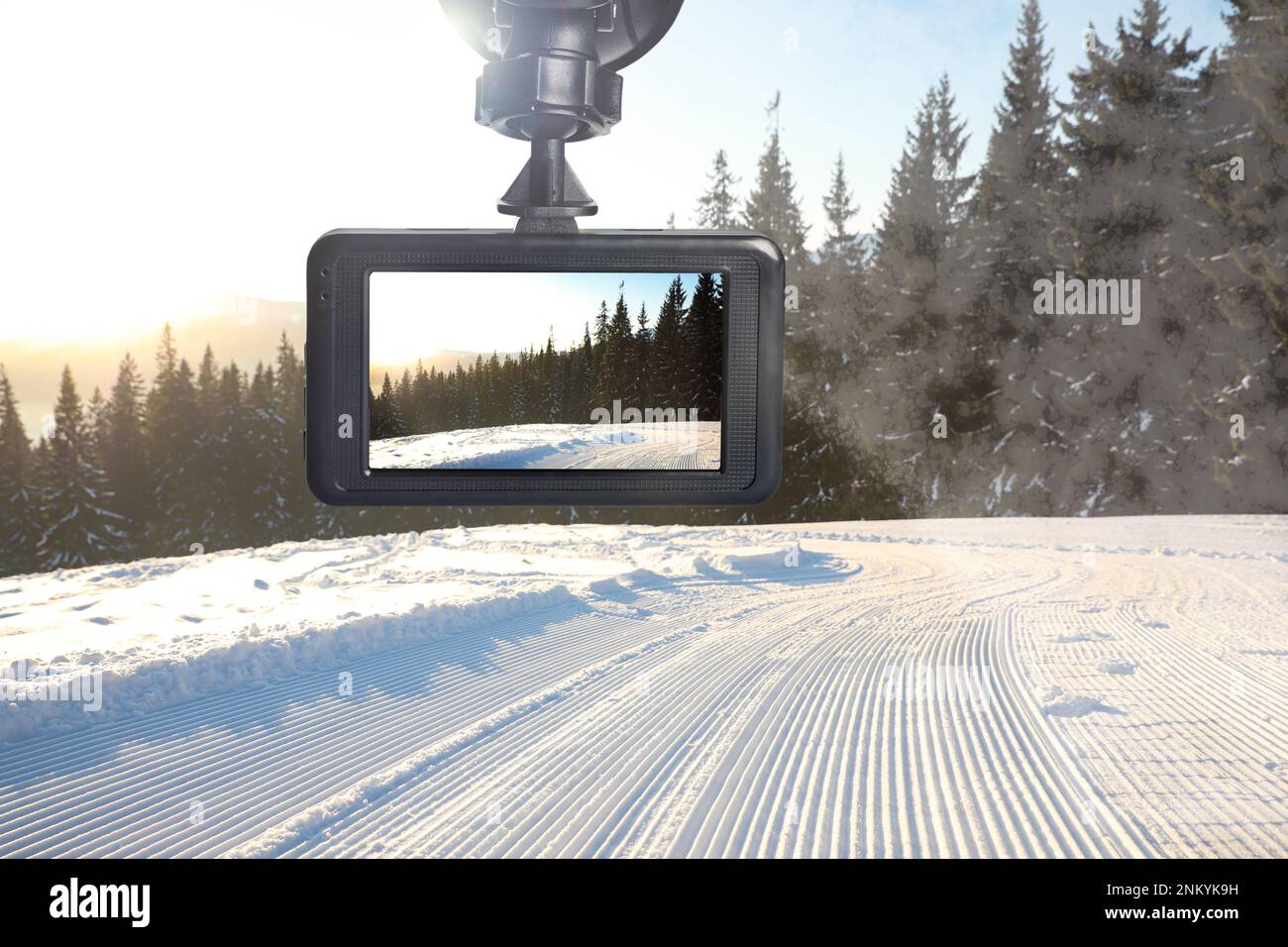 Modern dashboard camera mounted in car, view of road during driving ...