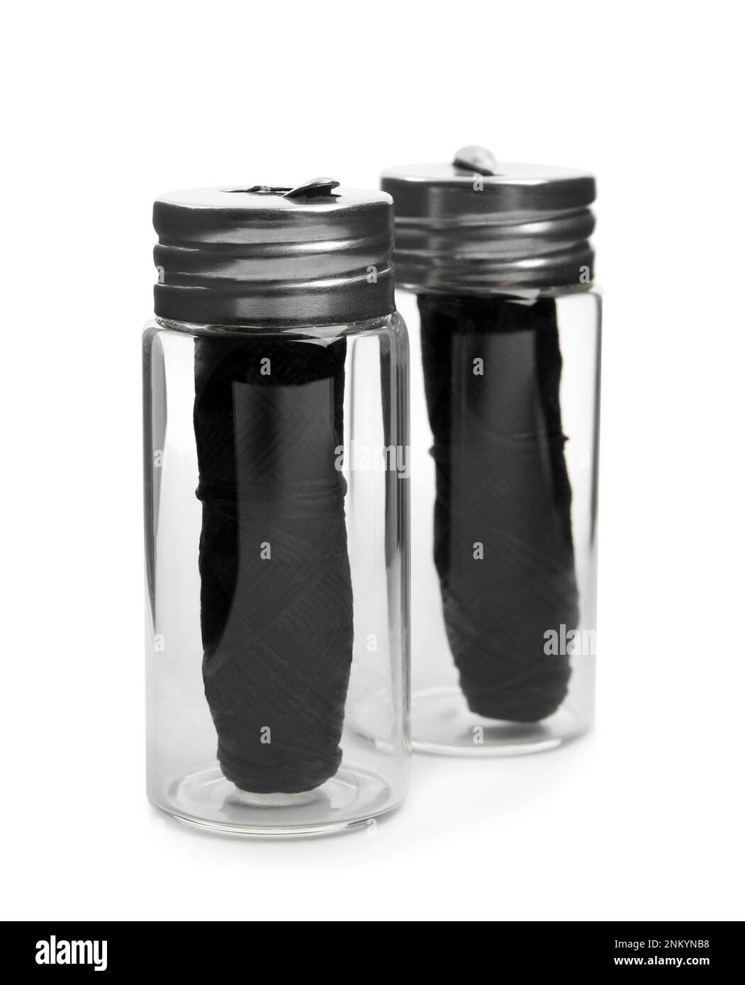 Rolls of natural organic dental floss in jars on white background Stock ...
