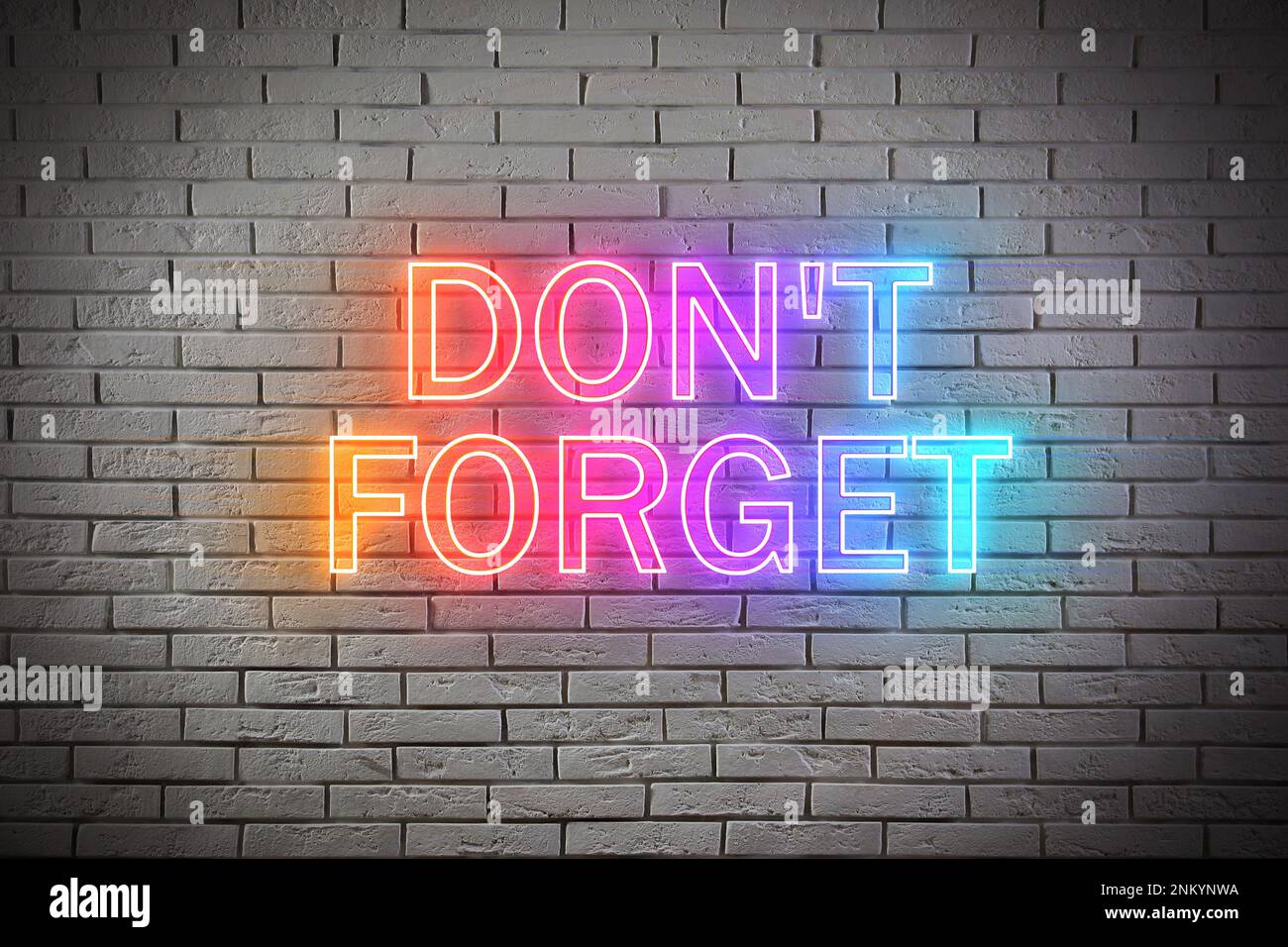 Phrase Don't forget against brick background. Reminder Stock Photo - Alamy