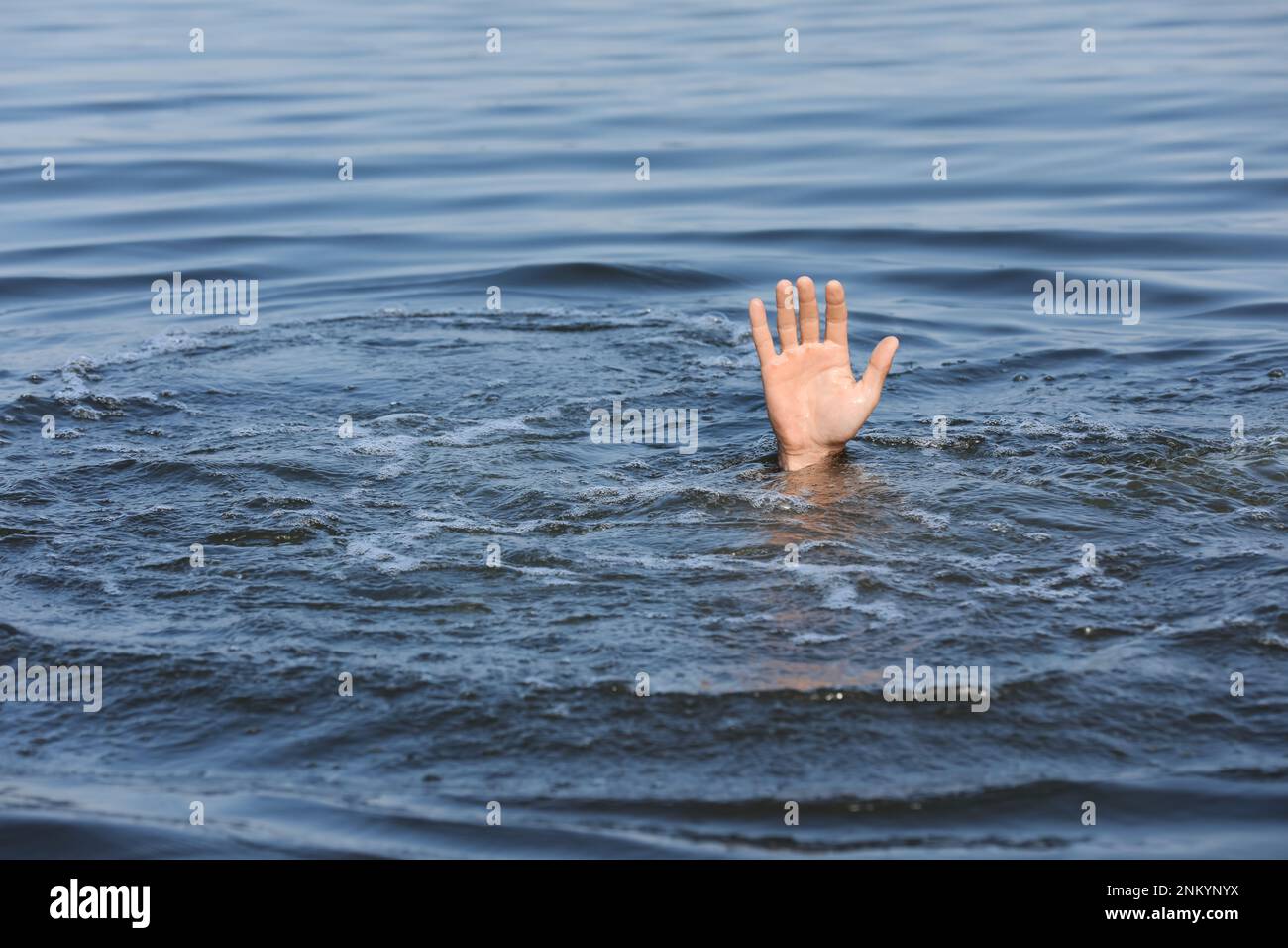 Drowning man reaching for help in sea, closeup Stock Photo - Alamy