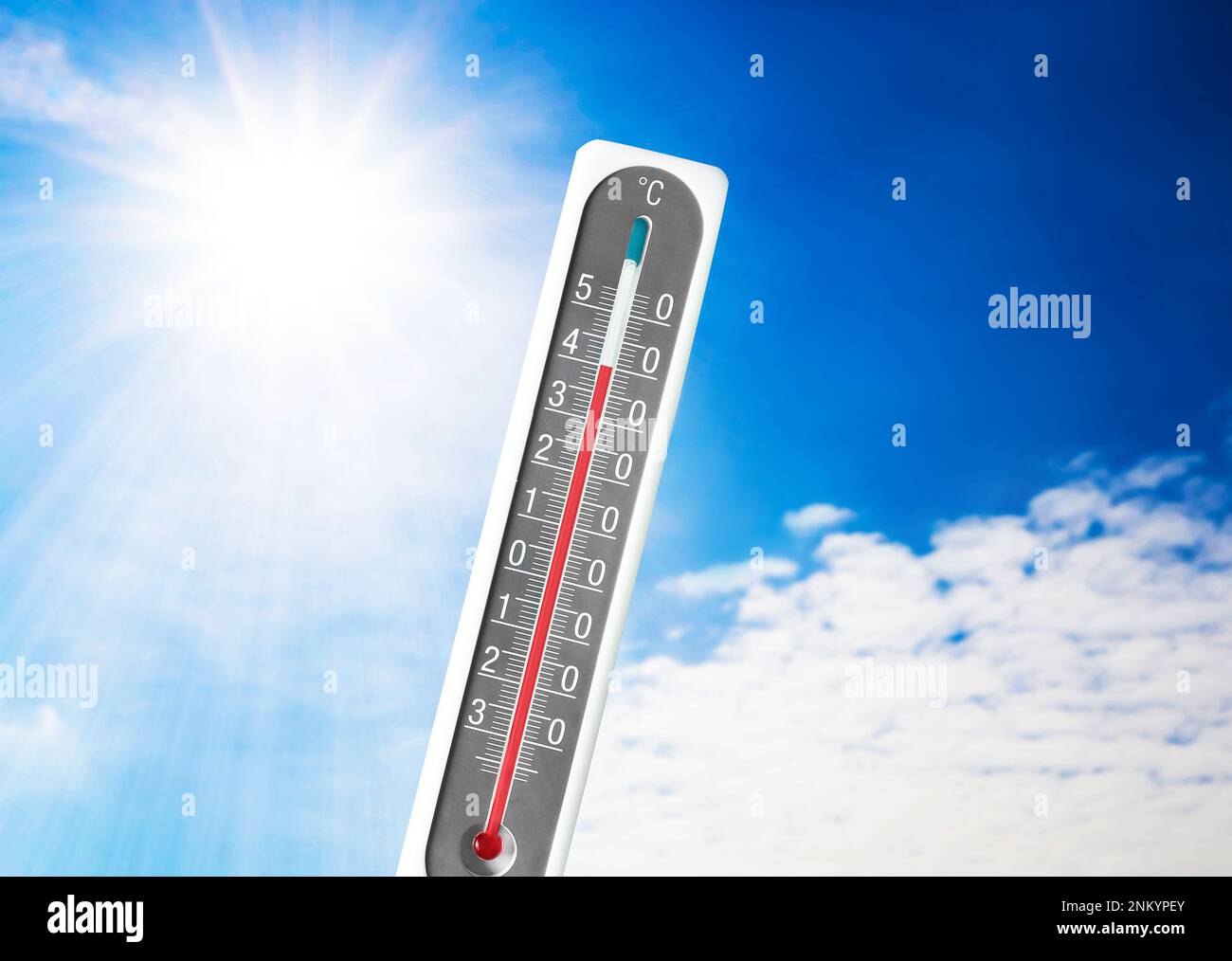 Weather thermometer with high temperature outdoors on hot sunny day ...