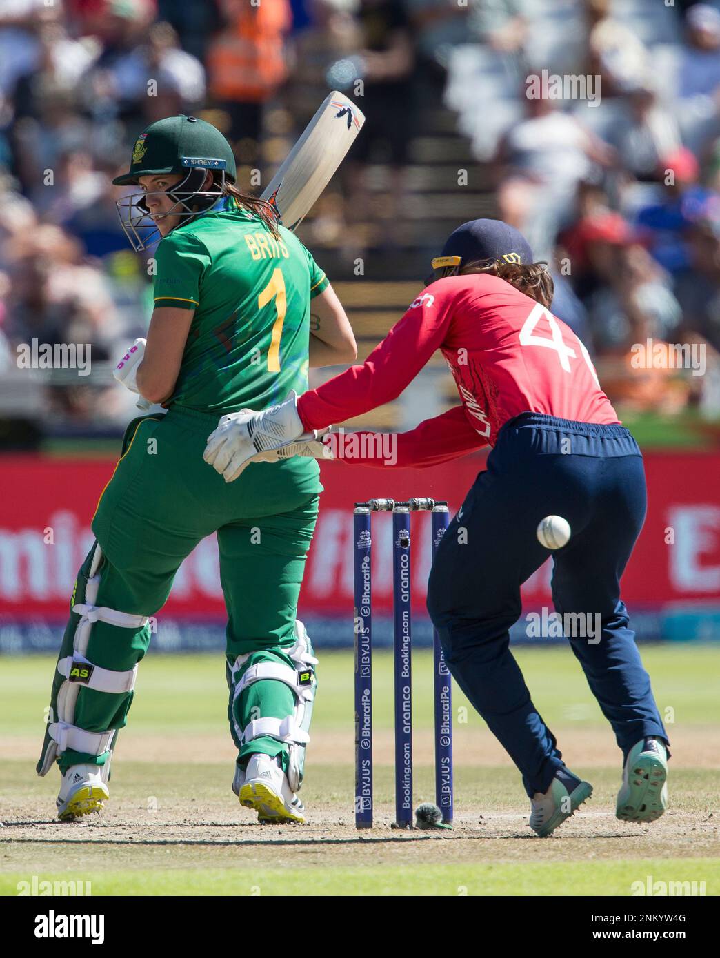 South Africa's Tazmin Brits, left, leaves the ball and England's Amy ...