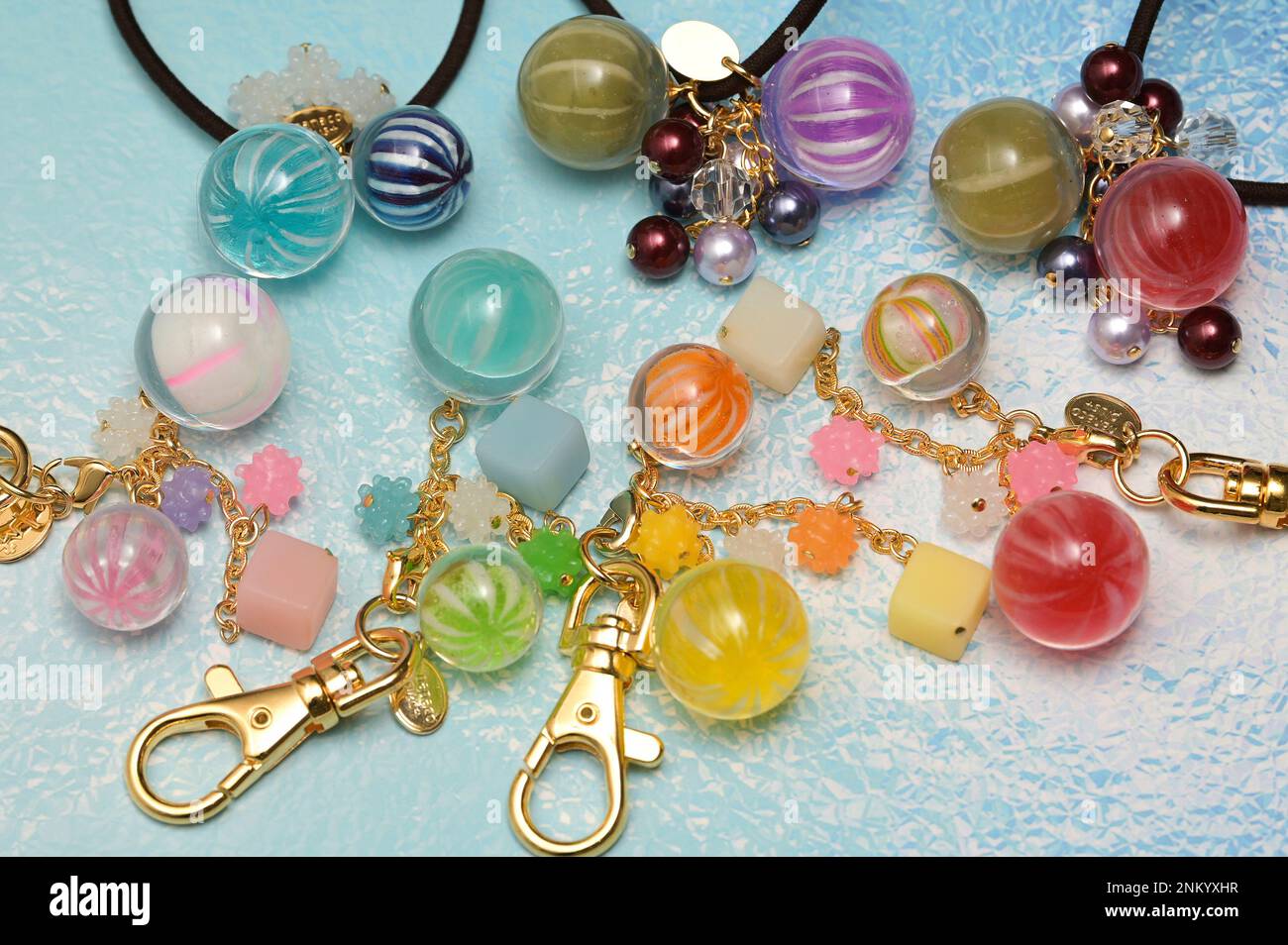 A picture shows accessories made of resin coated candy at nanaco plus+ ...