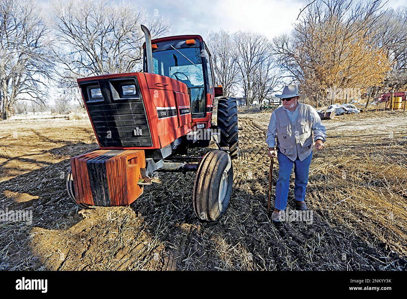 Paul Skrak, owner of Hidalgo Farms in Peña Blanca, New Mexico, warms up ...