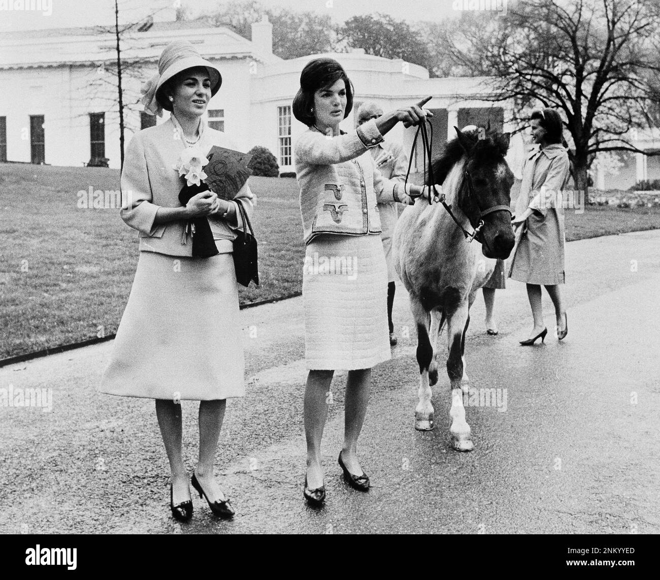FILE - First lady Jacqueline Kennedy leads her daughter Caroline's pony ...