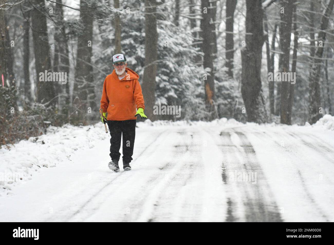 Kenneth Wolfe, of Pine Grove, walks along Clubhouse Road by Sweet Arrow ...