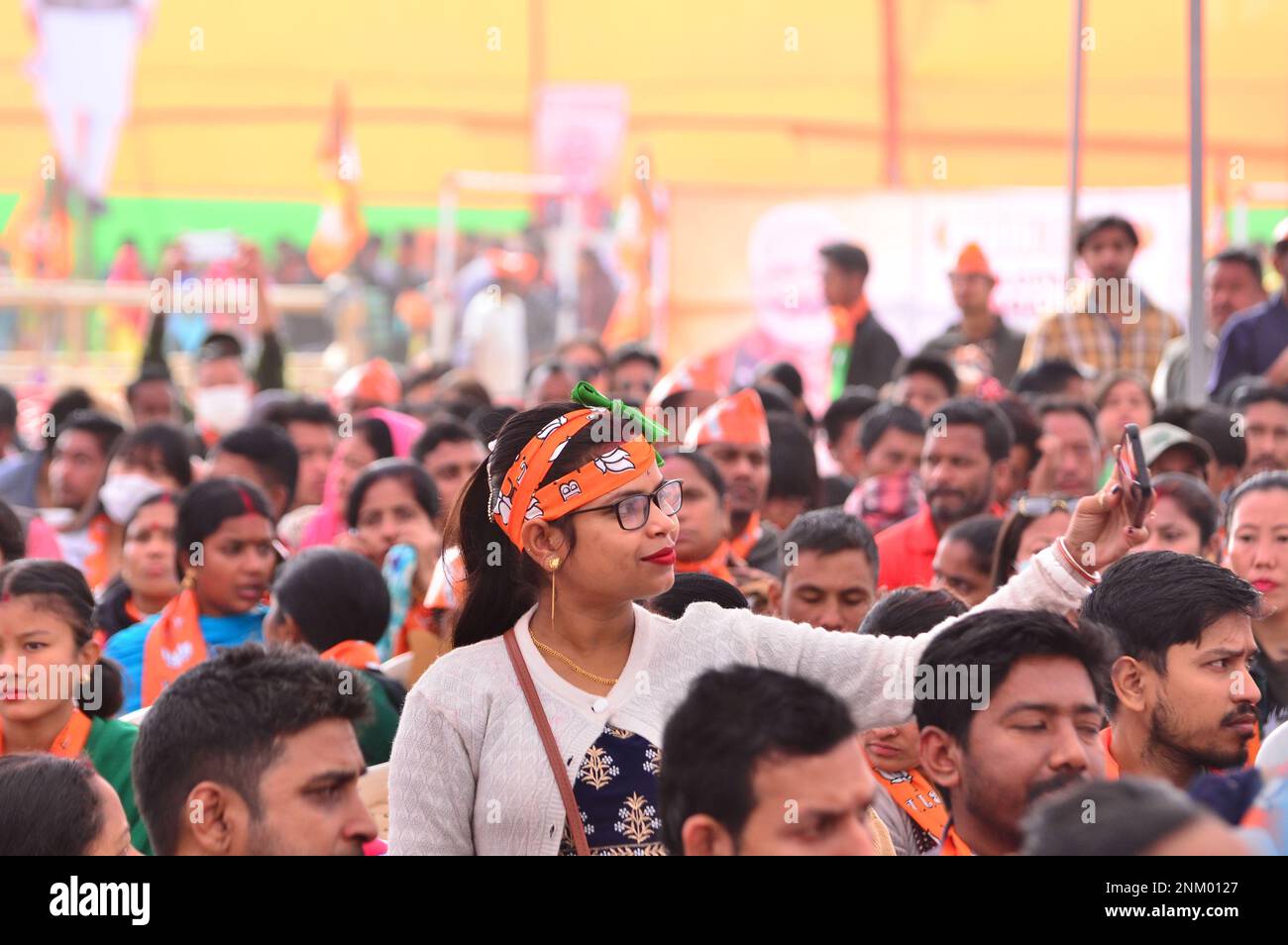 Chumukedima, India. 24th Feb, 2023. A BJP supporter takes a selfie ...