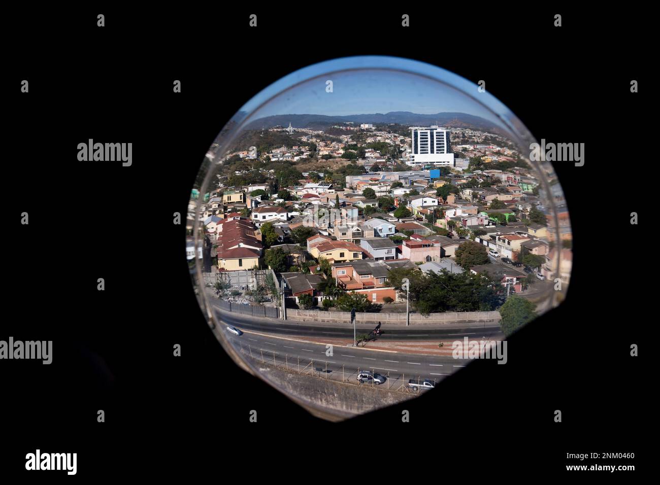 This photo shows the view out of a chinook window of Tegucigalpa ...