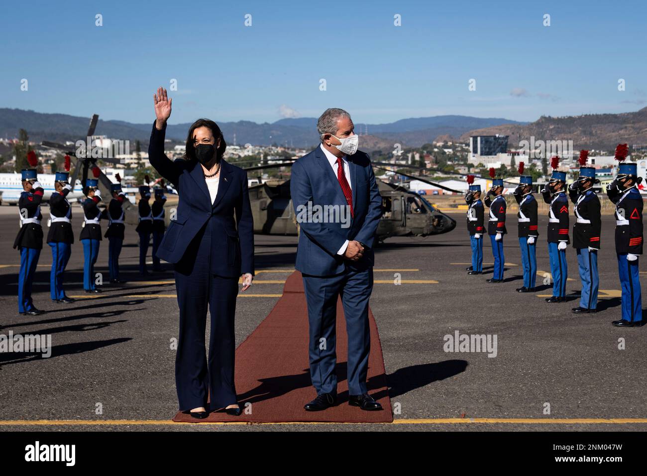 Vice President Kamala Harris waves as she stands with Amb. Ramon ...