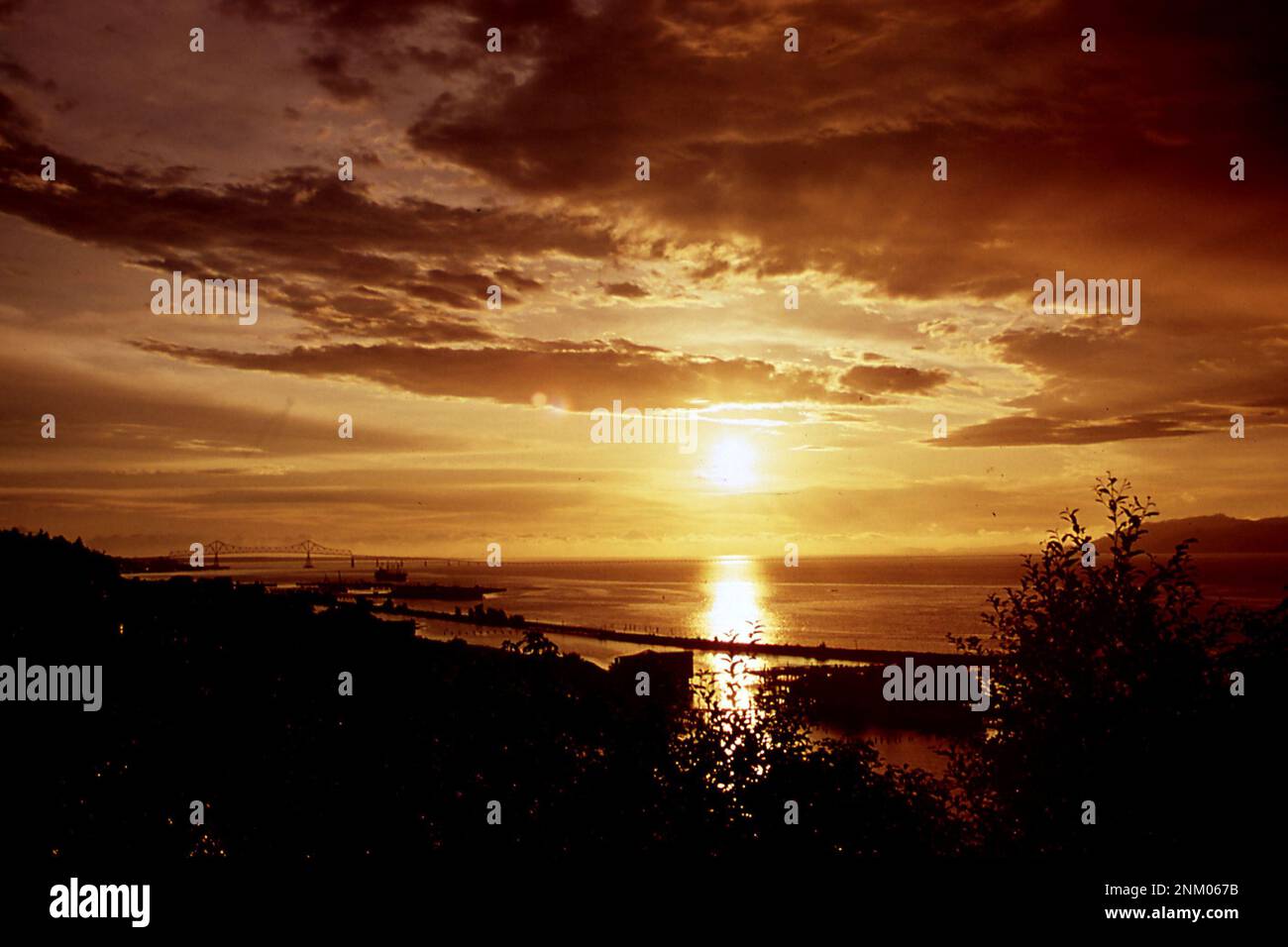 1970s United States: Sunset at the mouth of the Columbia River between ...