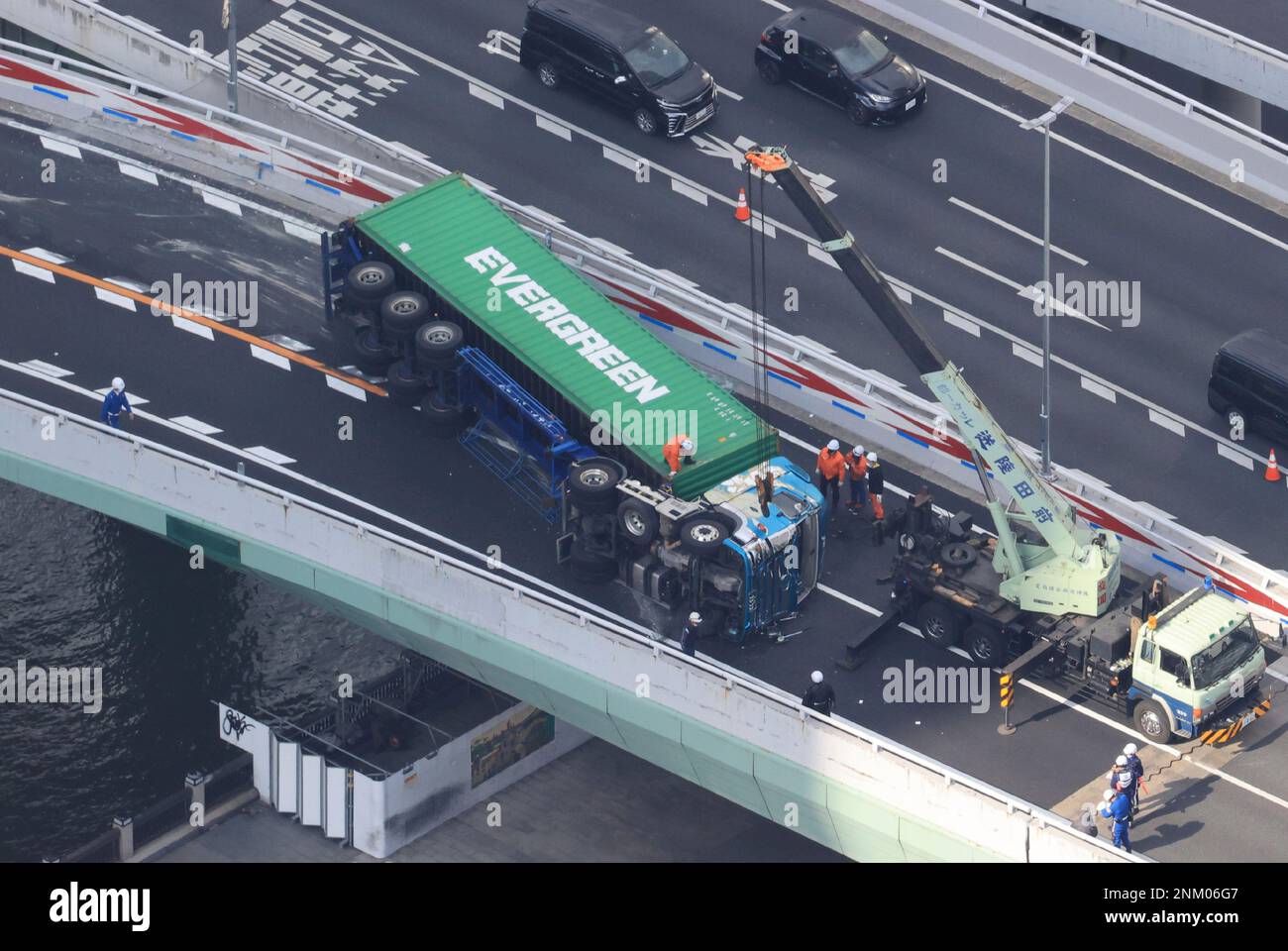 An aerial photo shows trailer having overturned at the junction of the ...