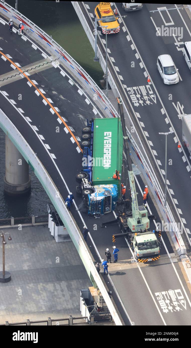 An aerial photo shows trailer having overturned at the junction of the ...