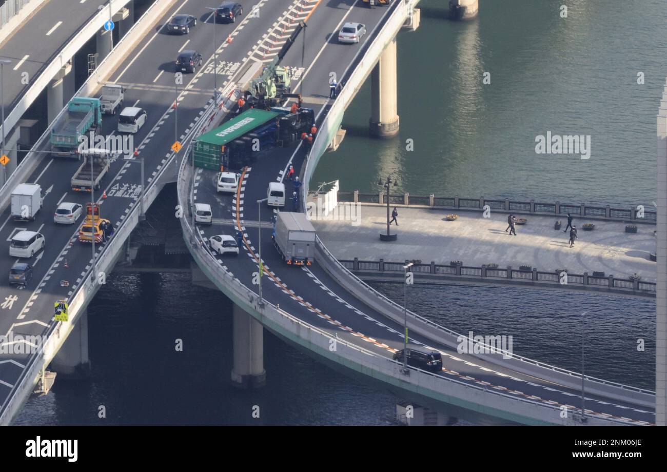 An aerial photo shows trailer having overturned at the junction of the ...