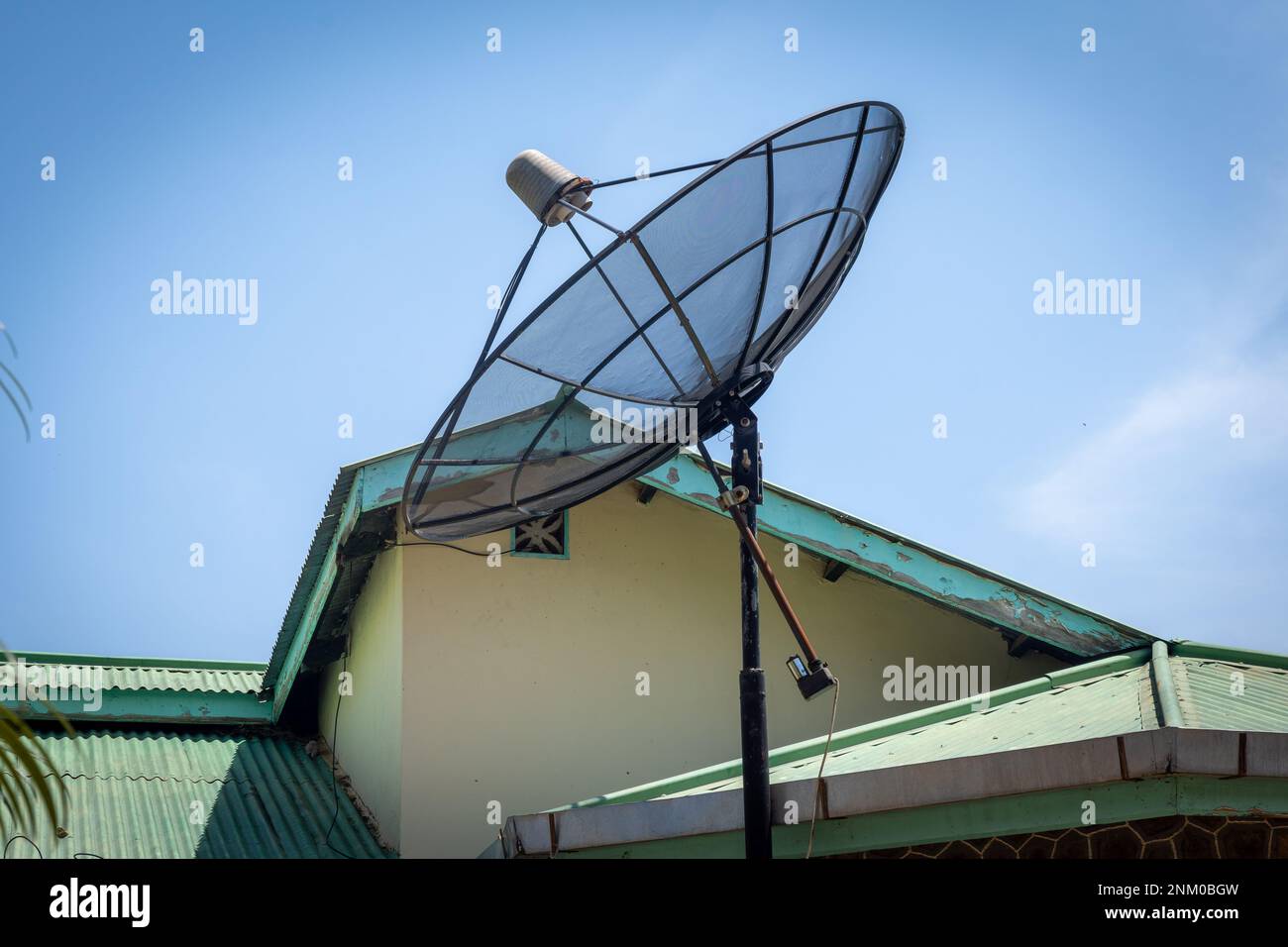 Big C-Band Satellite dish on roof of a house. Option to get free cable ...