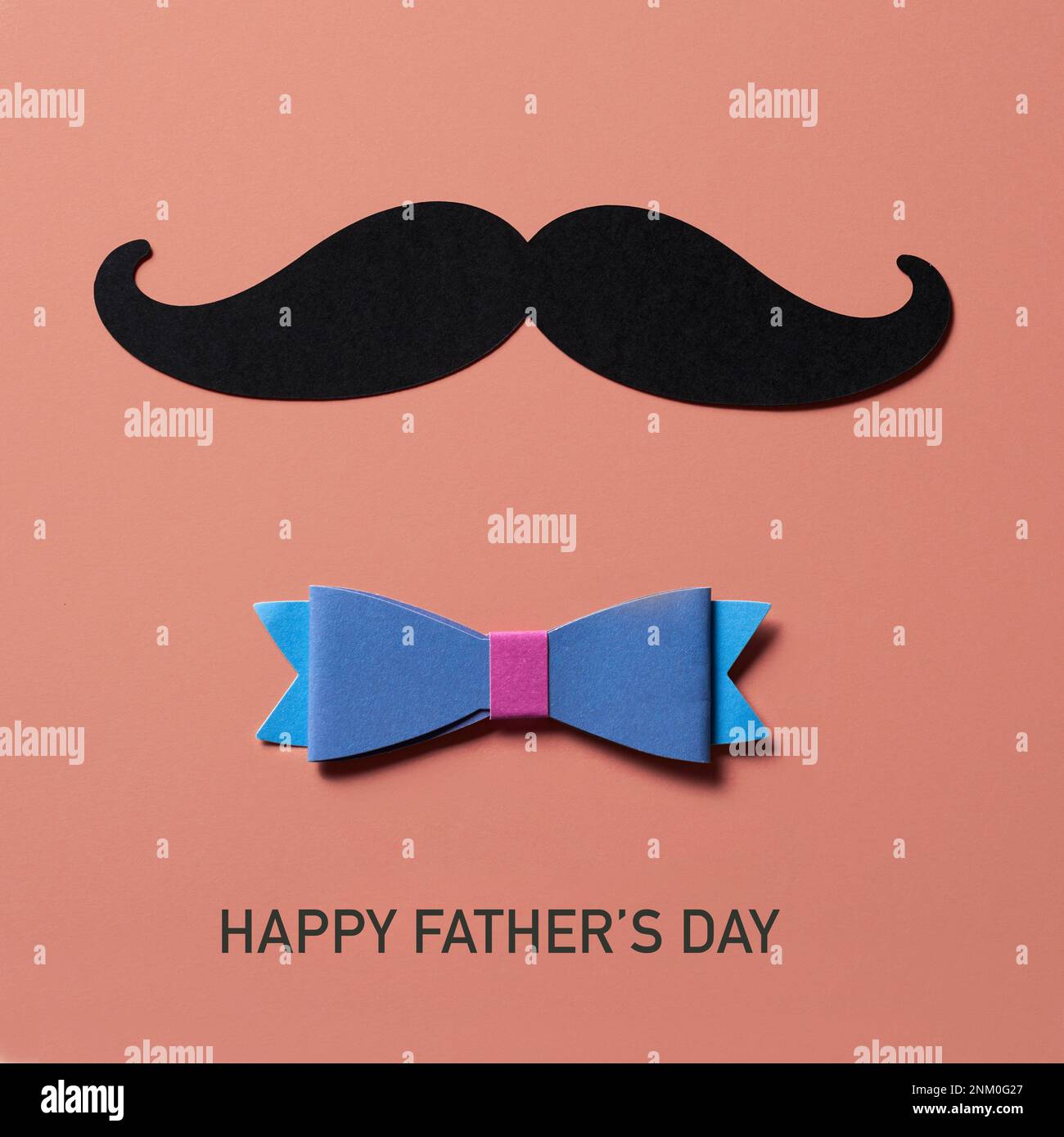 a moustache, made with a cutout of a black cardboard, a multicolored ...