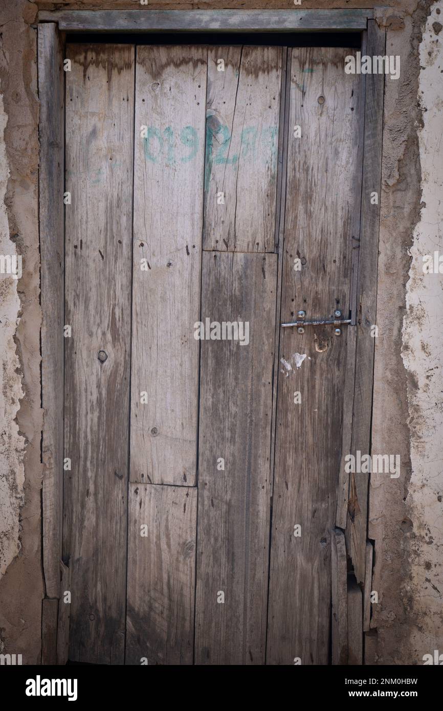 Old wooden door of a broken building Stock Photo - Alamy